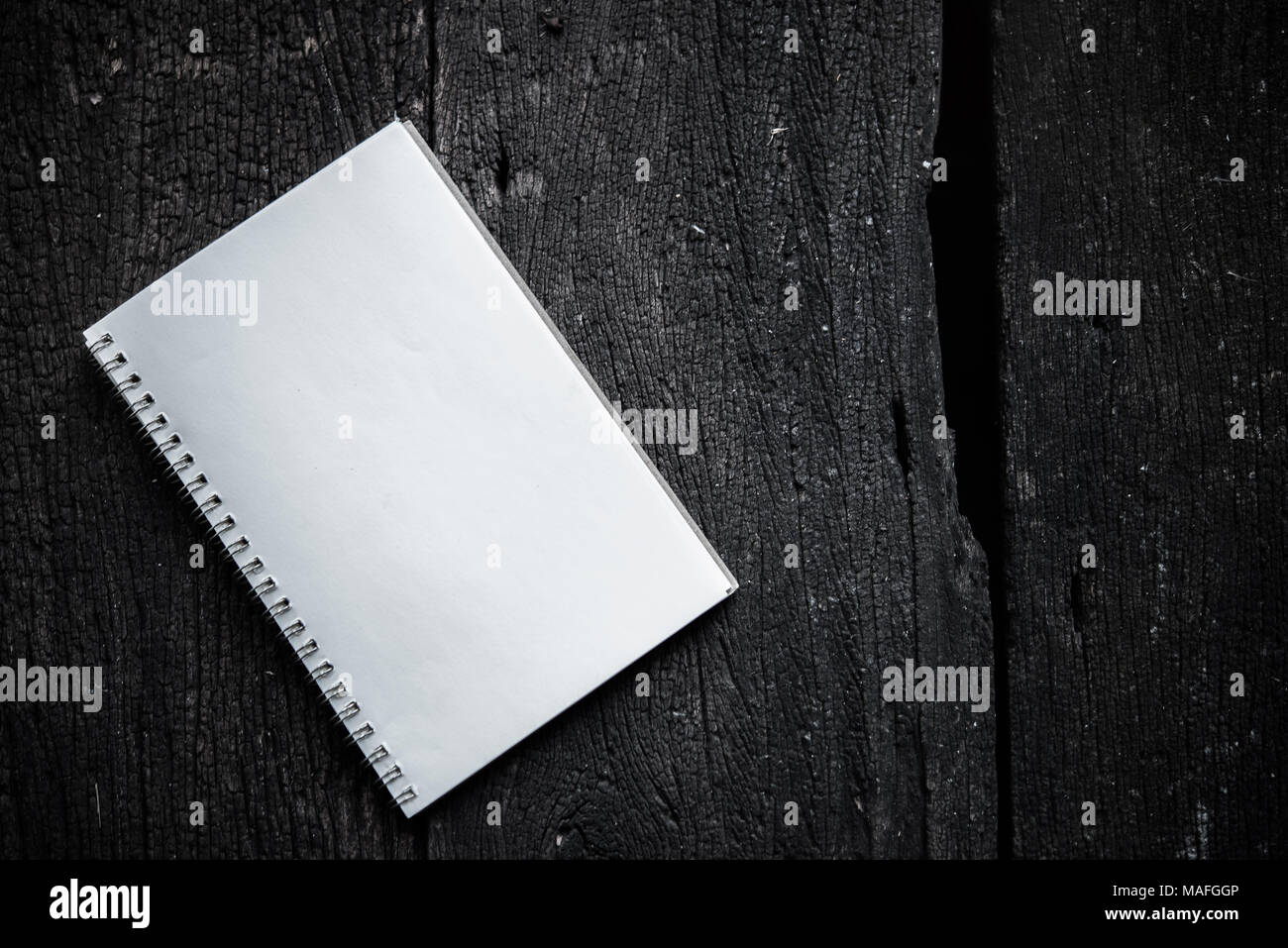 Notebook on wood texture background Stock Photo - Alamy
