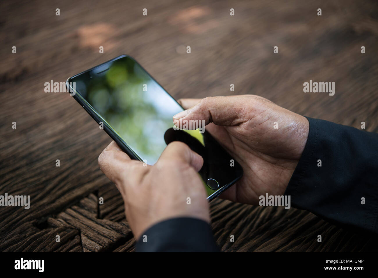 hand holding smart phone and play something Stock Photo - Alamy