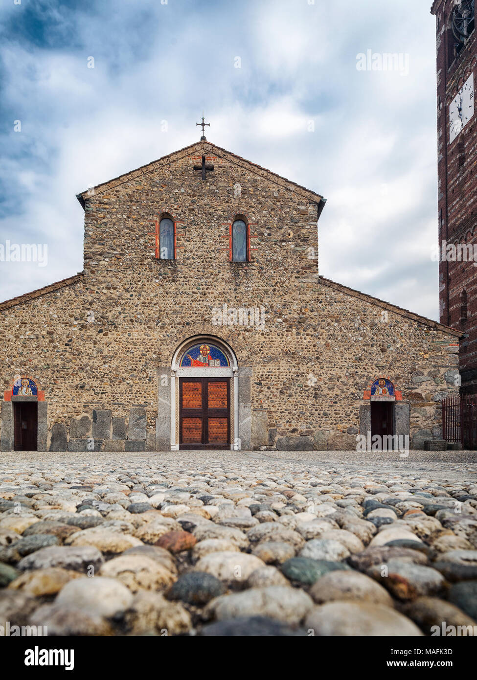 Front view of the romanesque italian church and belfry, Basilica di San ...