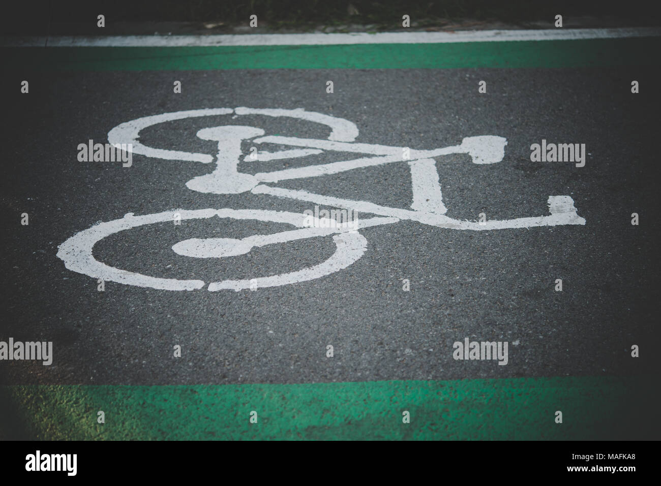 Indicate symbol on road for bicycles Stock Photo - Alamy