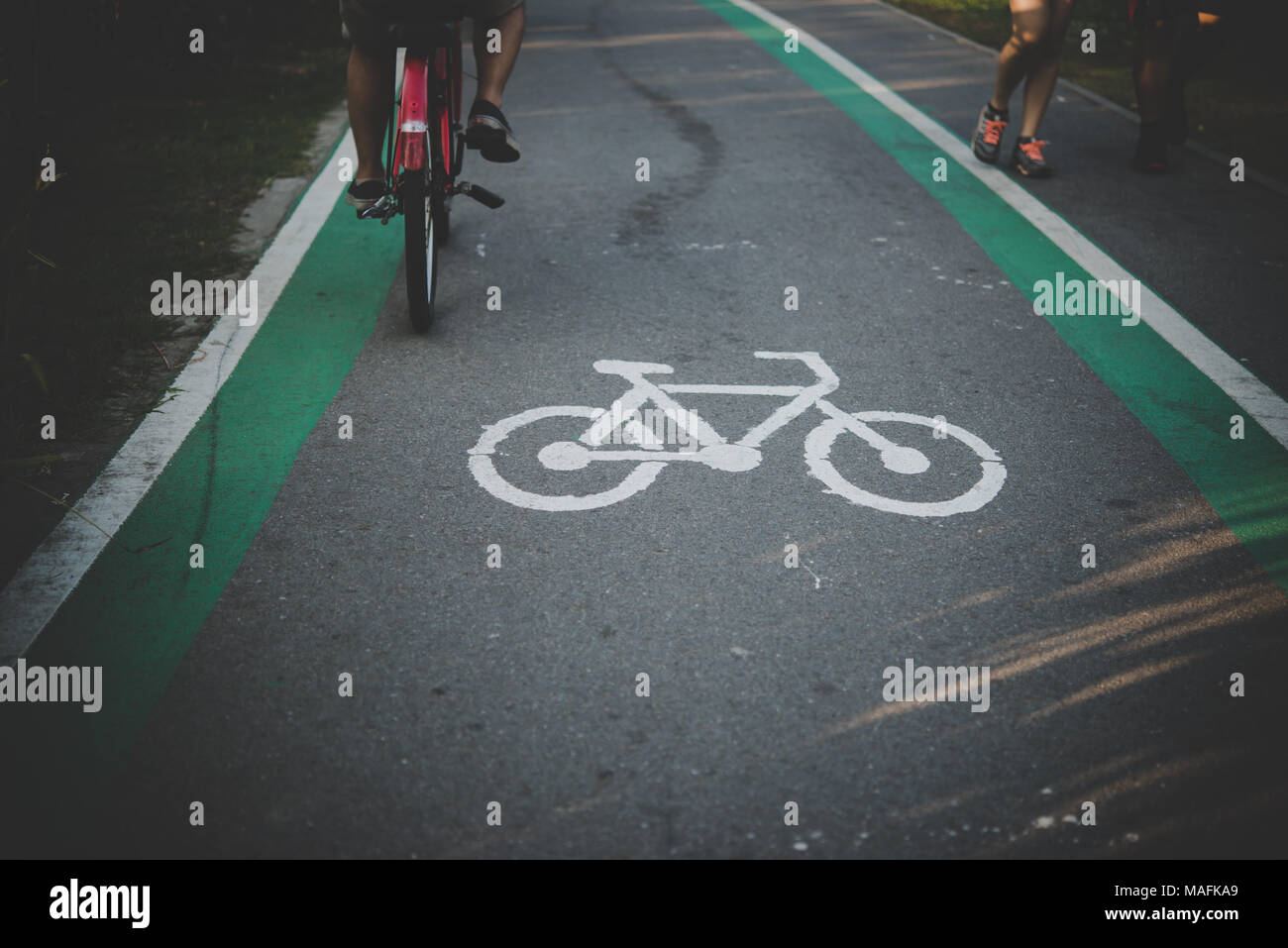 Indicate symbol on road for bicycles Stock Photo - Alamy