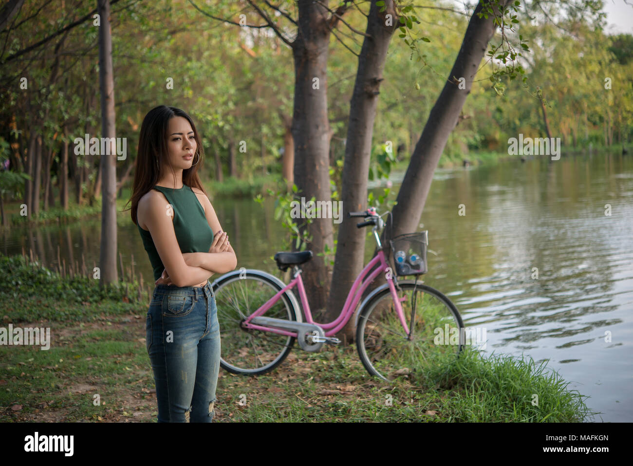 Young pretty girl was sad standing in the park she was disappointed and ...