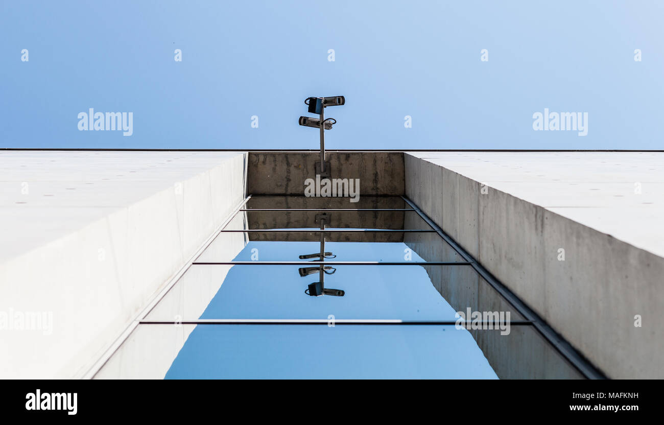 Single surveillance camera on facade of contemporary business ...