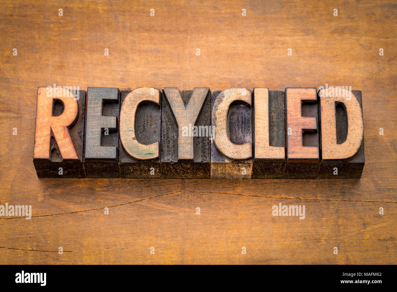 recycled word in vintage letterpress wood type against grunge wooden ...