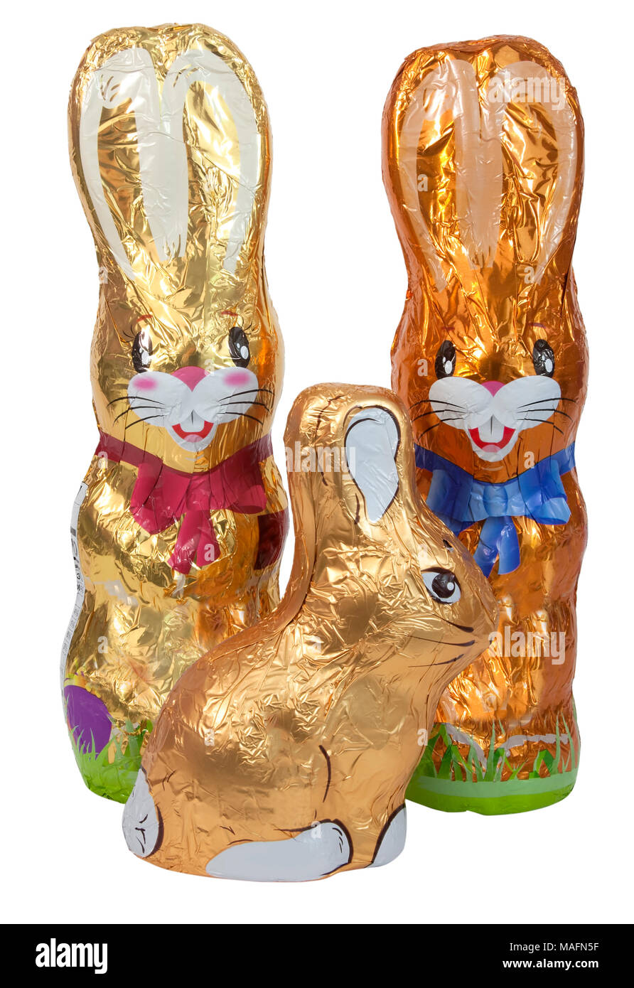 Foil-wrapped chocolate Easter bunny family. Isolated Stock Photo - Alamy
