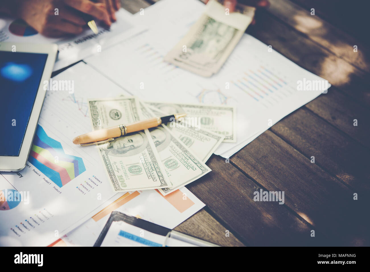 Business team workplace on a new business plan with money, Working in ...