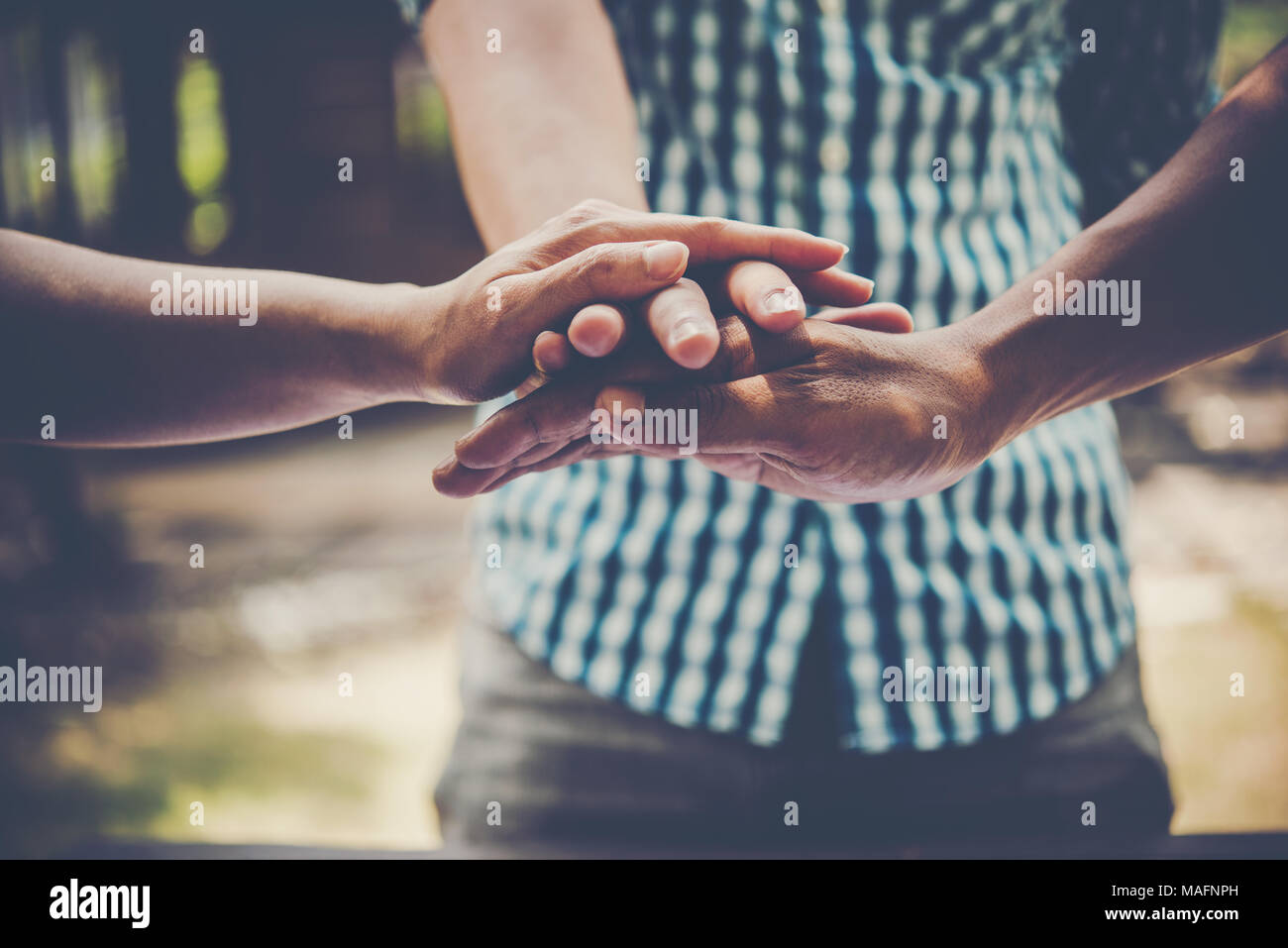 Business people making pile of hands. Teamwork concept Stock Photo - Alamy