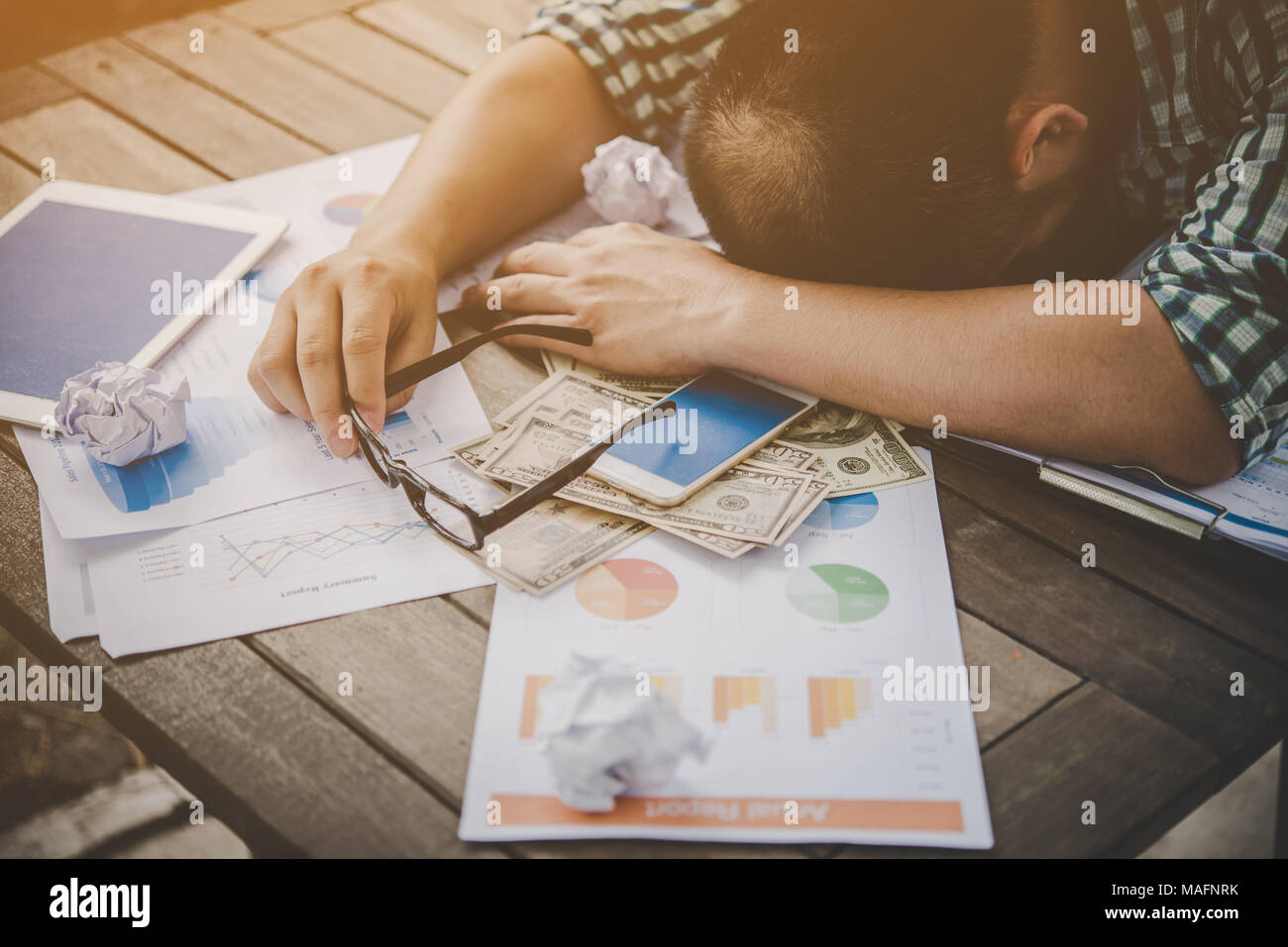 Tired working man sleeping at the workplace full of work Stock Photo ...