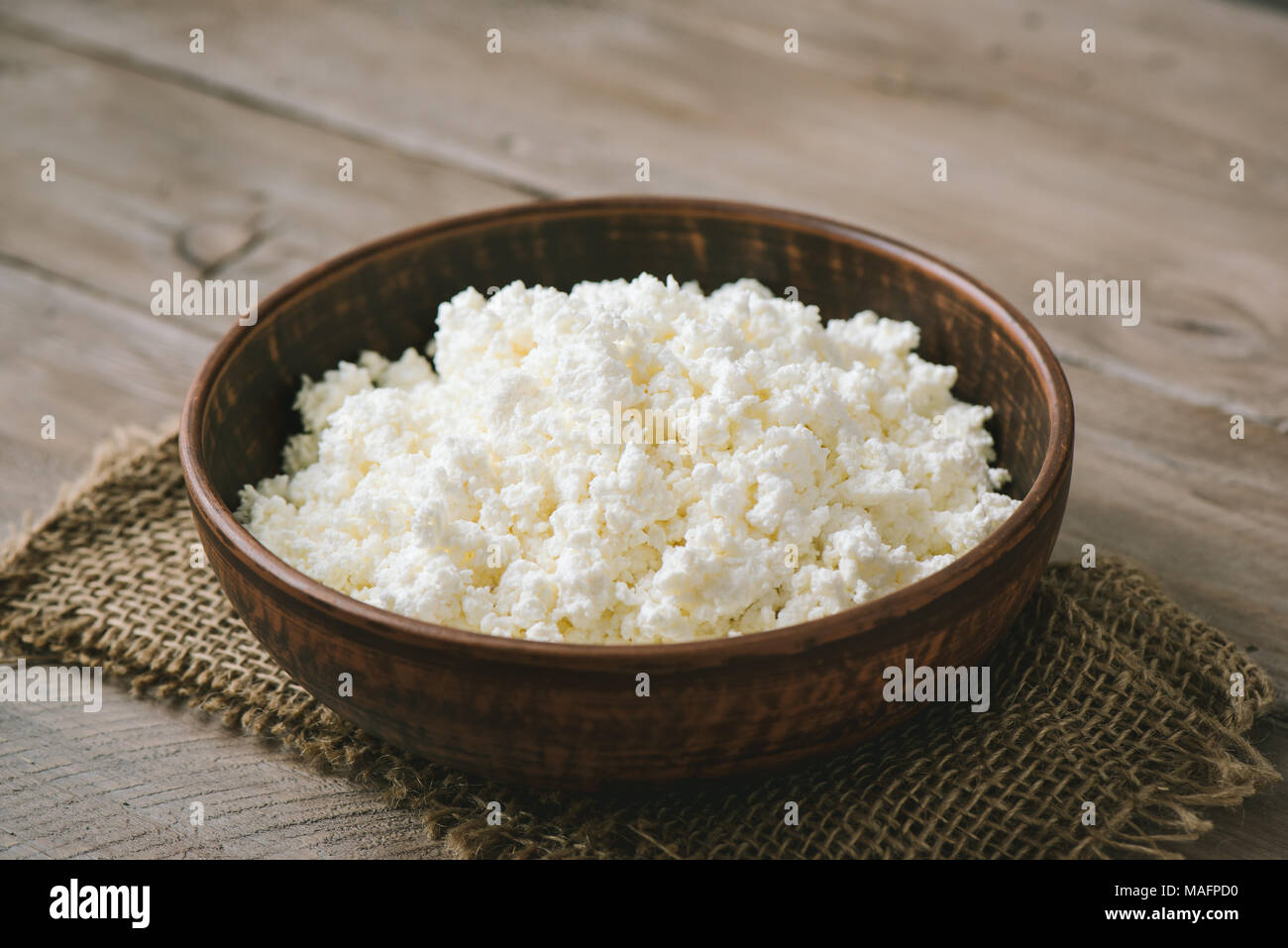 Cottage cheese, curd on rustic wooden table, top view, copy space ...
