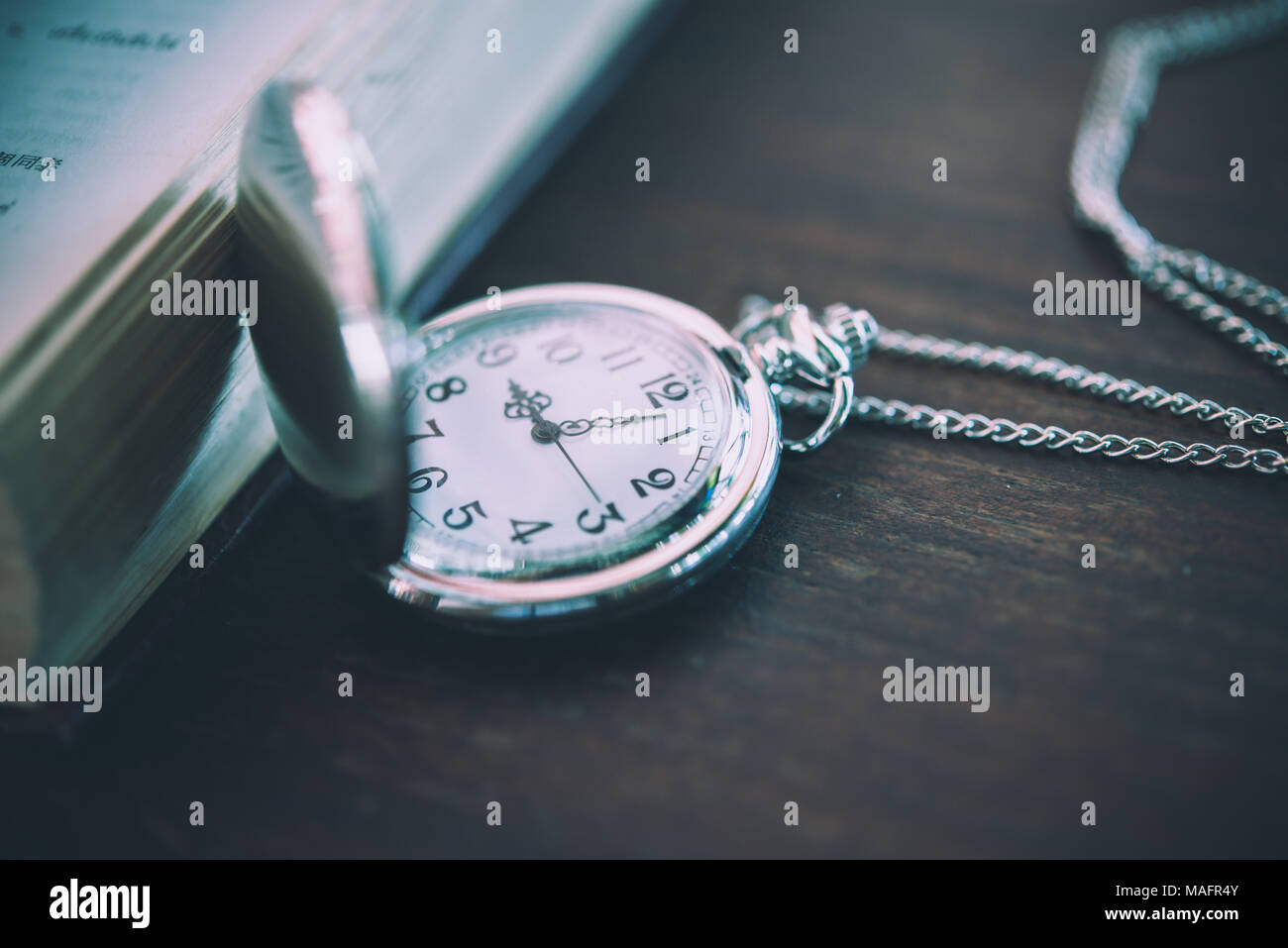 Vintage pocket watch , symbols of time with copy space Stock Photo - Alamy