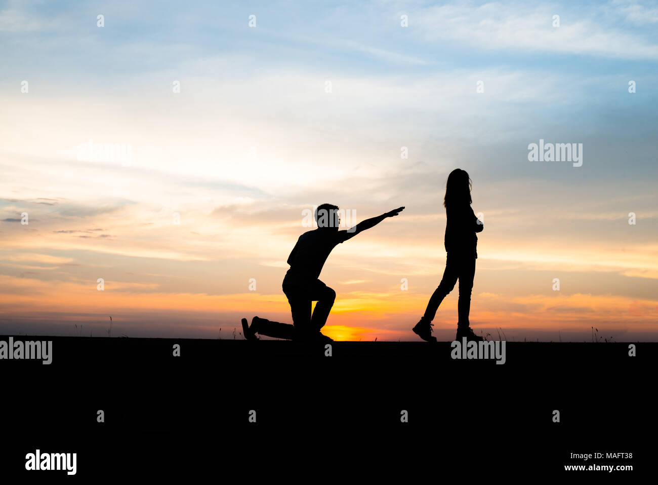 Silhouette of couple upset,man and women are quarrel in sunset time ...