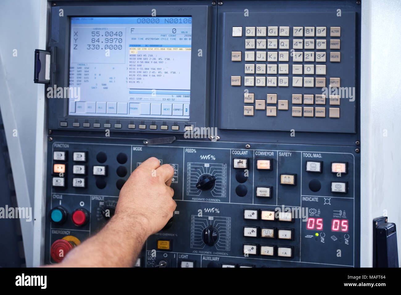 factory engineer controlling and pressing important technology button ...