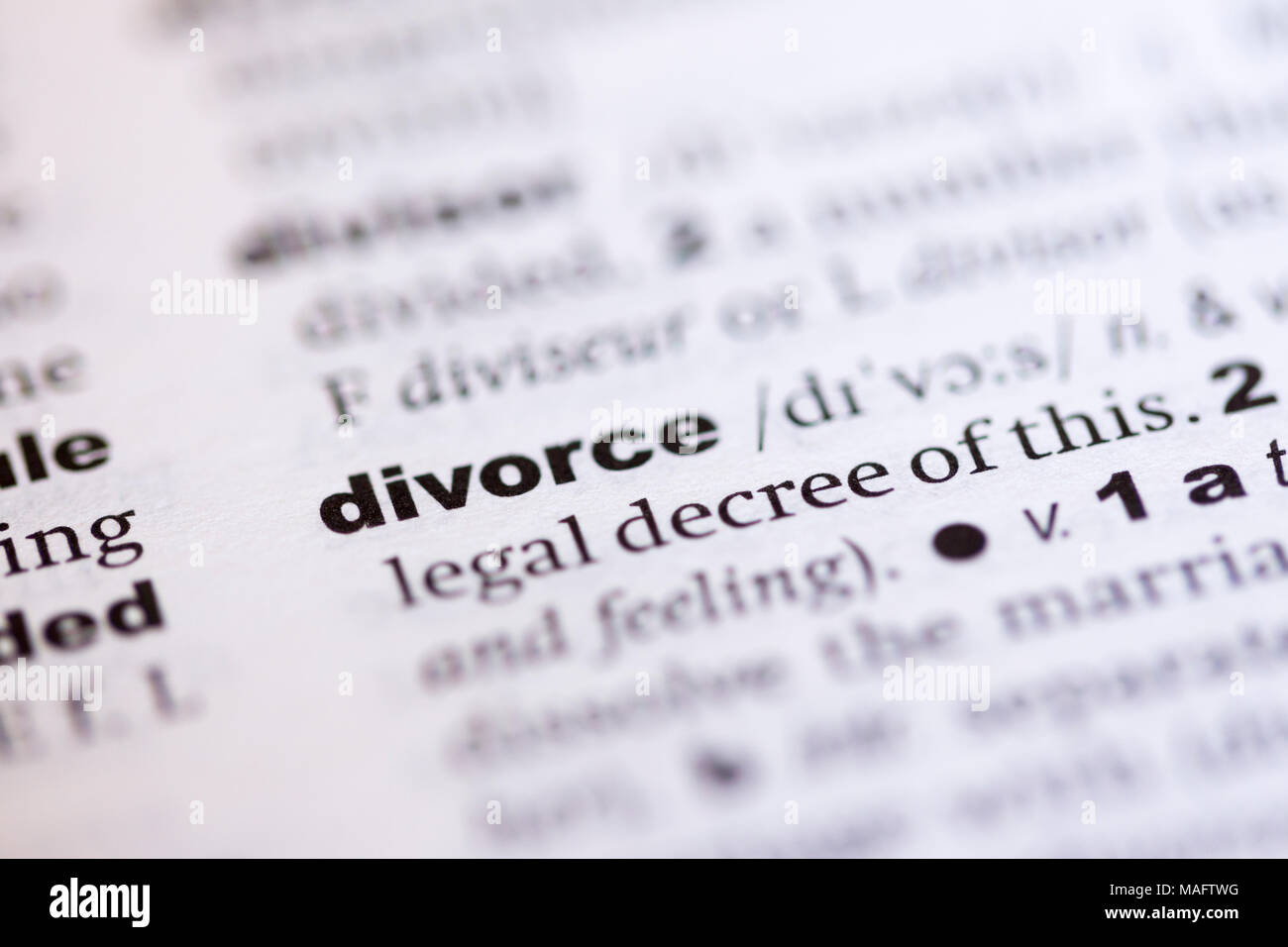 A macro shot showing the definition of the word divorce in an English ...
