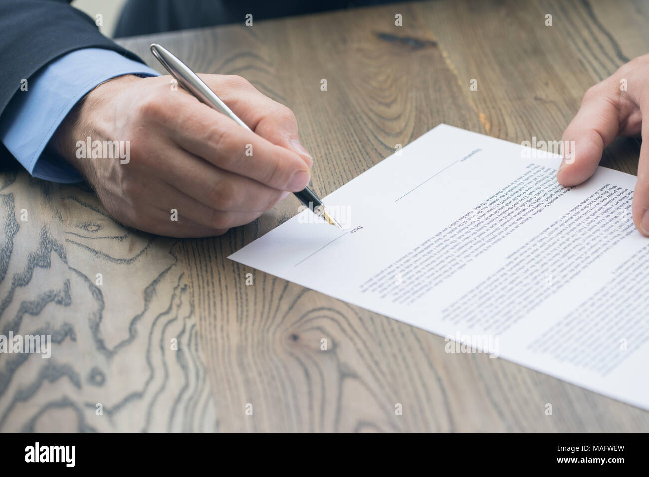 Businessman desk signing agreement focus hi-res stock photography and ...