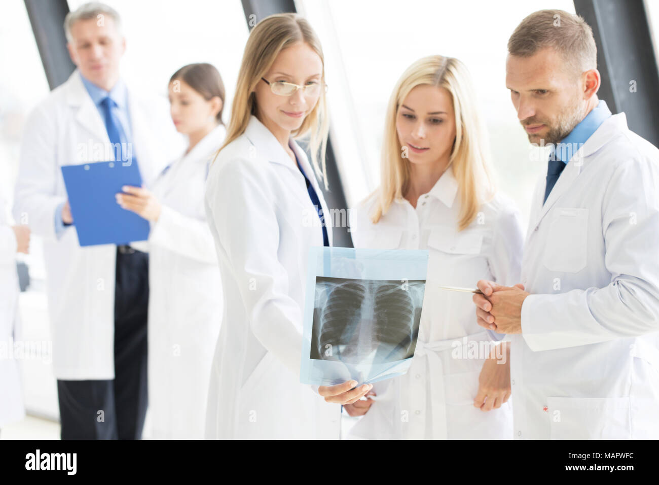 Healthcare, medical and radiology concept - group of doctors looking at ...