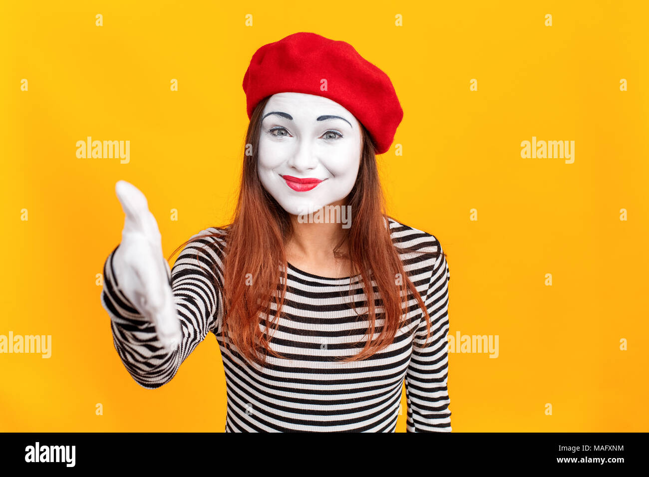 Handshake. Closeup portrait of mime woman showing hi, hello sign ...