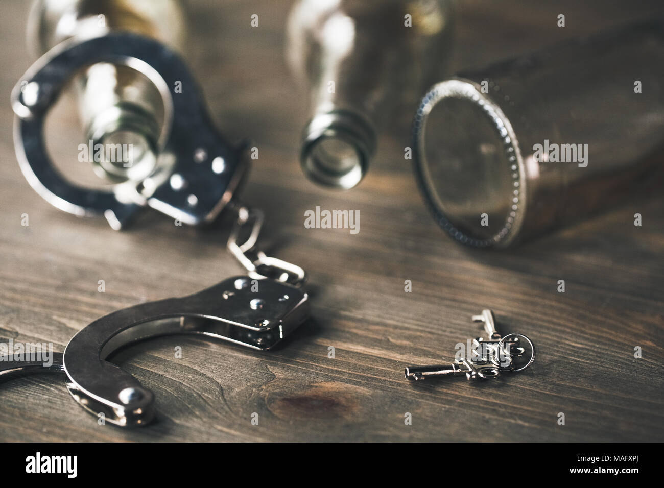 Alcohol addiction objects isolated on table no people key opened ...