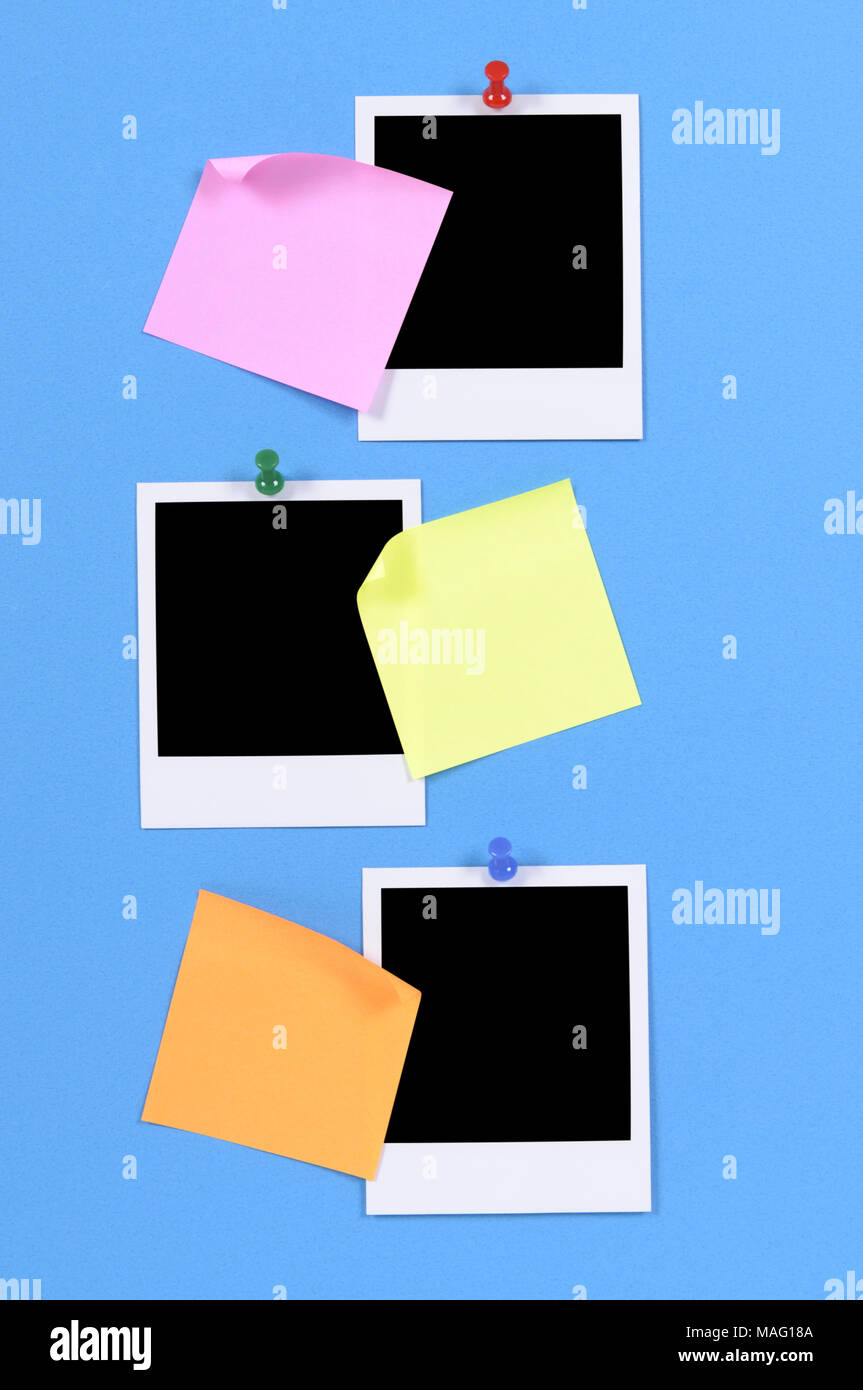 Blank photo prints with sticky notes pinned to blue paper Stock Photo ...