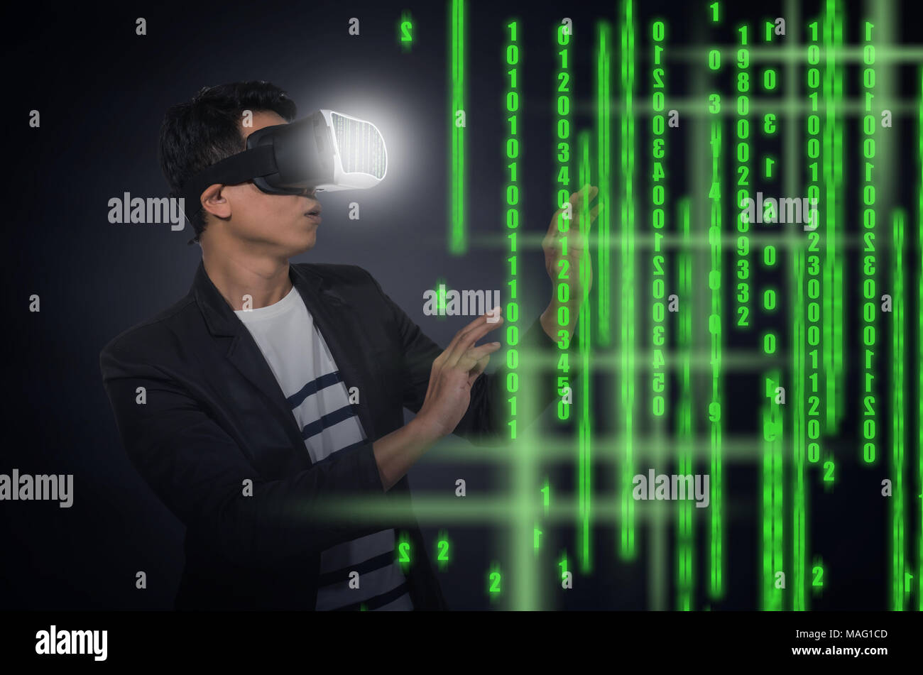Asian Man wearing virtual reality Looking the digital numeric display ...