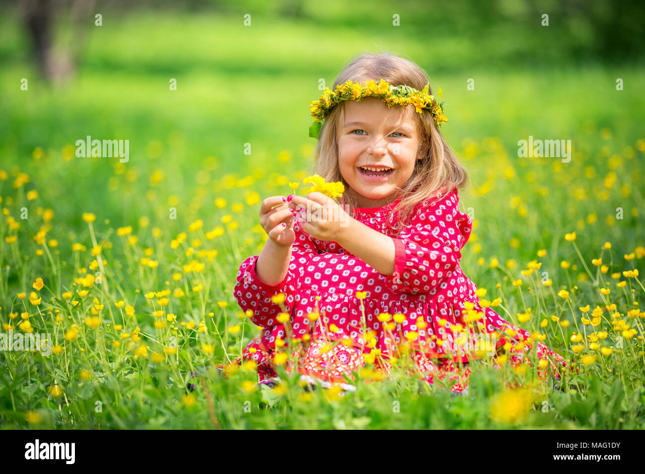 Little girl in spring park Stock Photo - Alamy