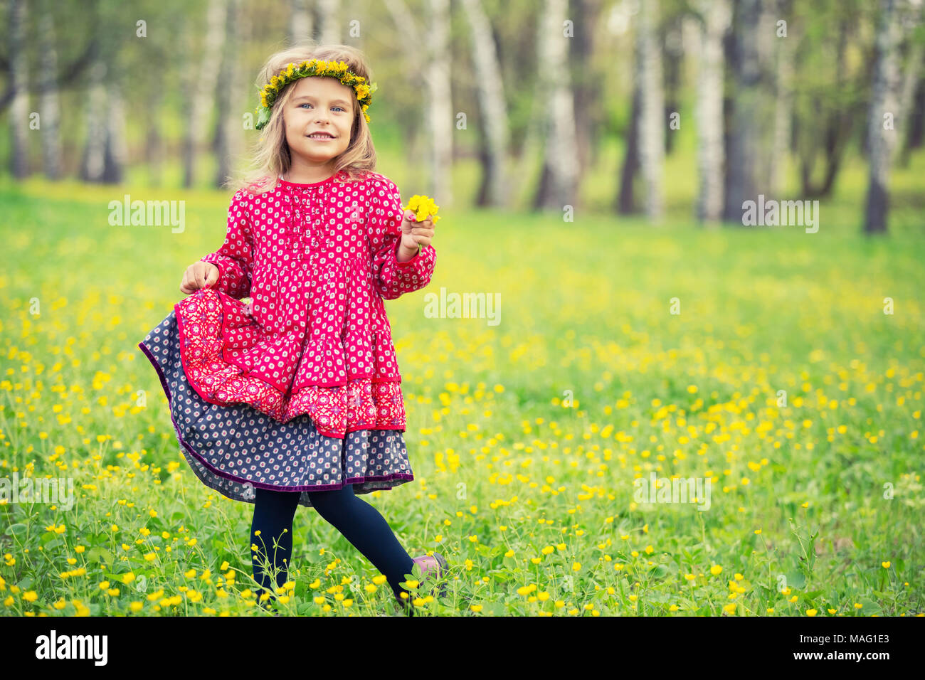 Little girl in spring park Stock Photo - Alamy
