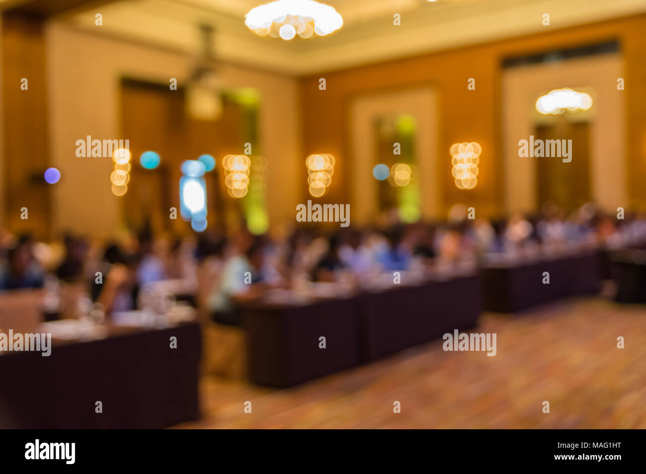 Abstract blurred photo of conference hall or seminar room with attendee ...