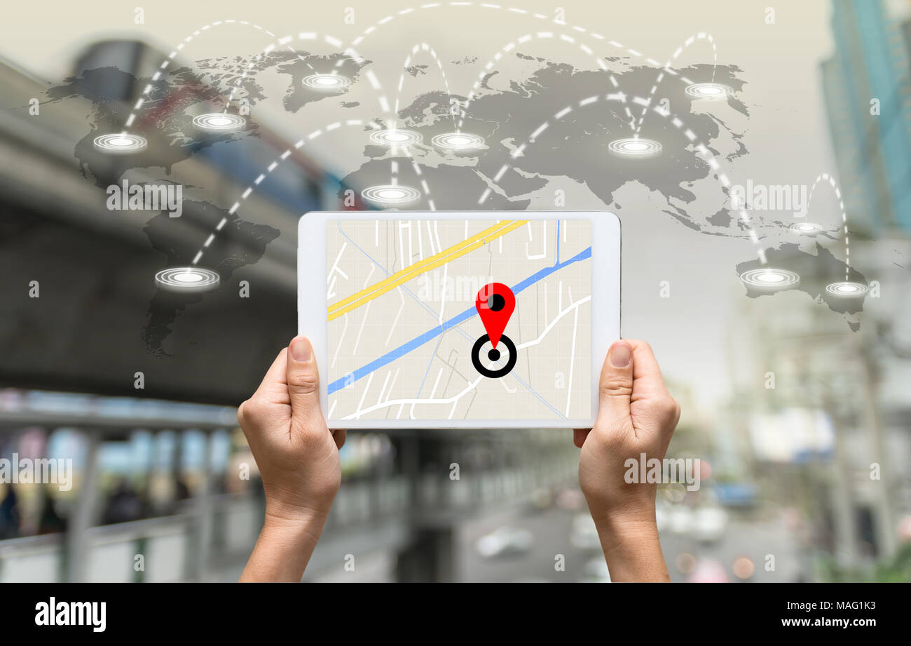 female hands holding a tablet showing part of navigator map on ...