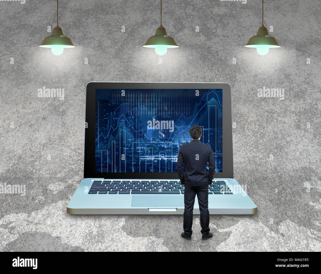 Businessman standing over the computer laptop on the concrete with part ...
