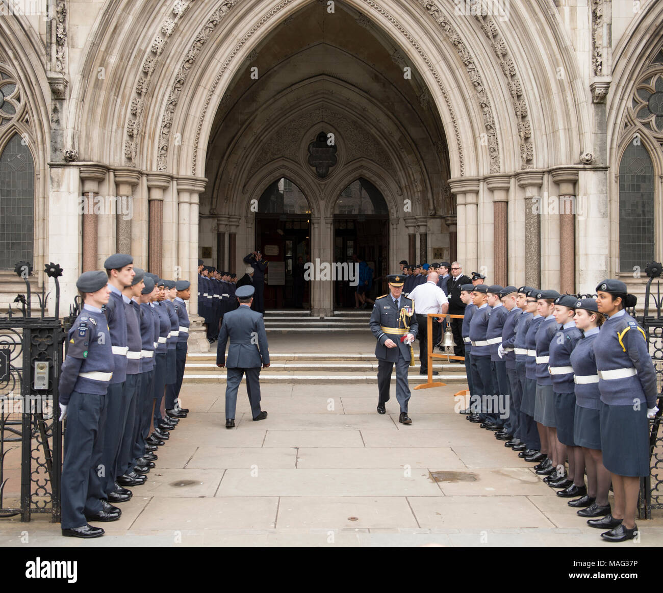 RAF Air Cadets line the entrance to the Royal Courts of Justice before ...