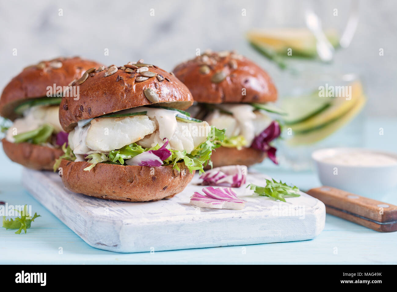 White fish fillet sandwich with tartar sauce and salad Stock Photo - Alamy
