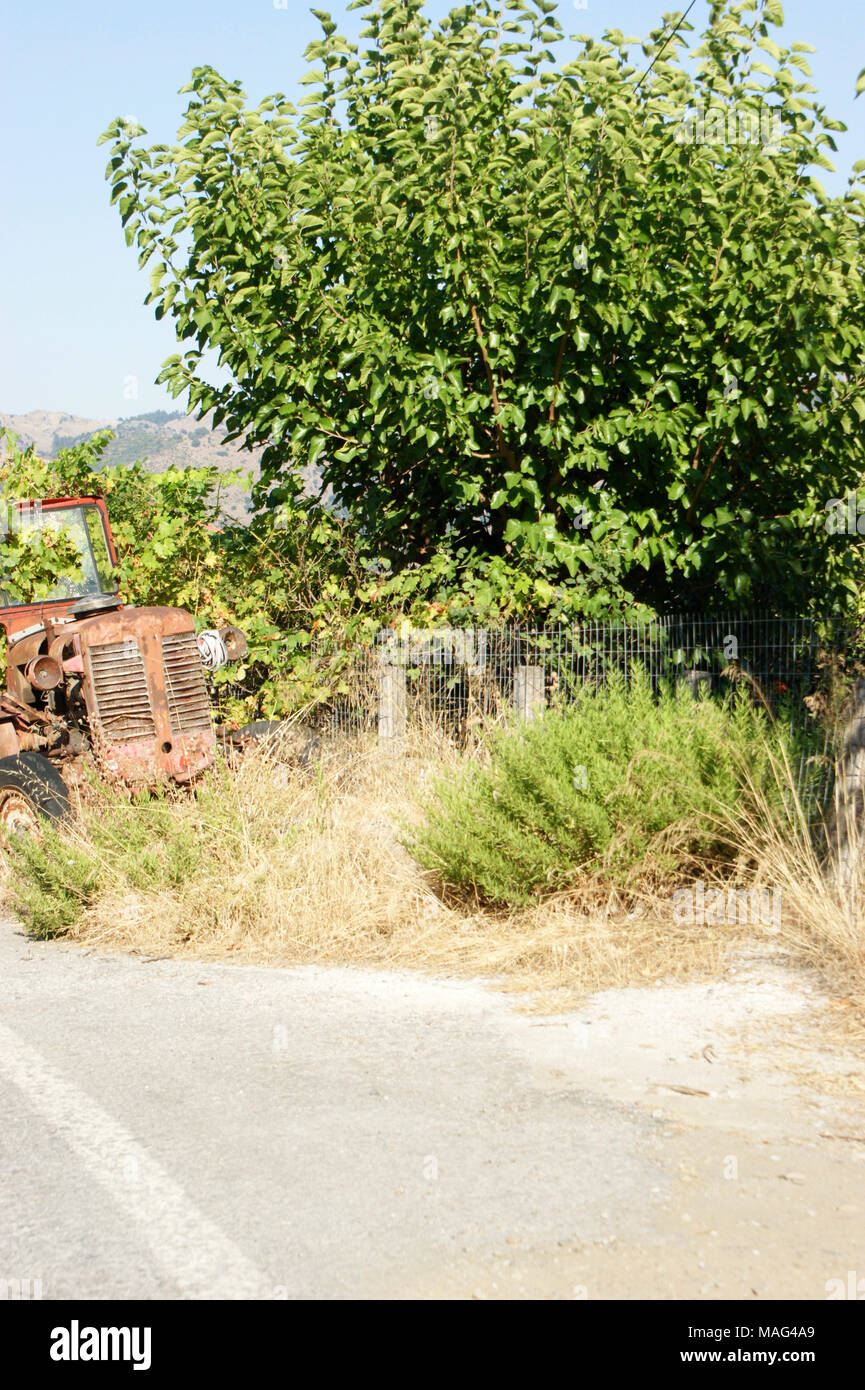 Old and rusty tractor on the farm, agriculture in Greece in Crete Stock ...
