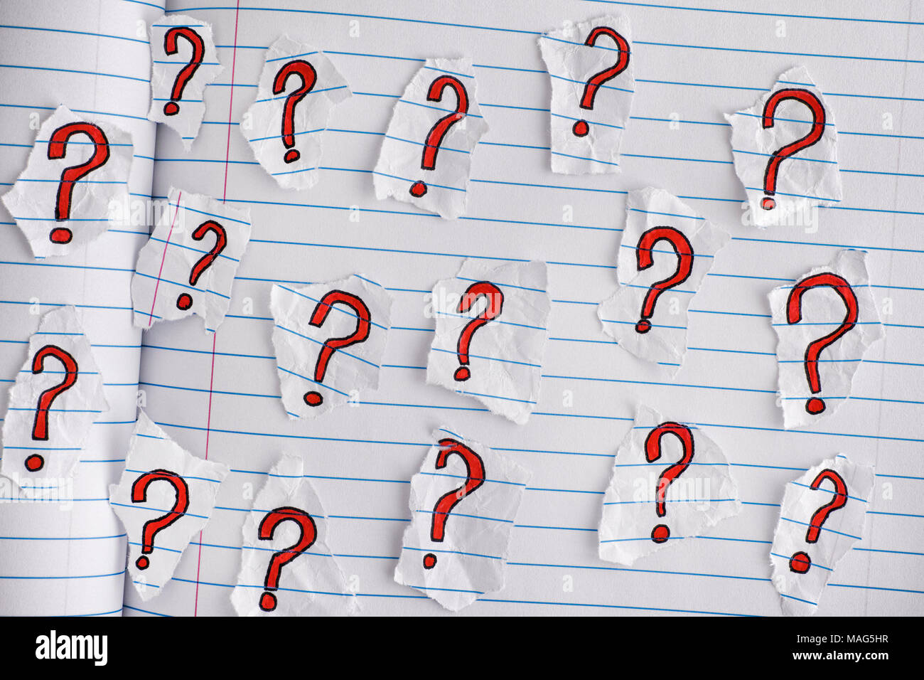 Question marks on lined paper sheet. Close up Stock Photo - Alamy
