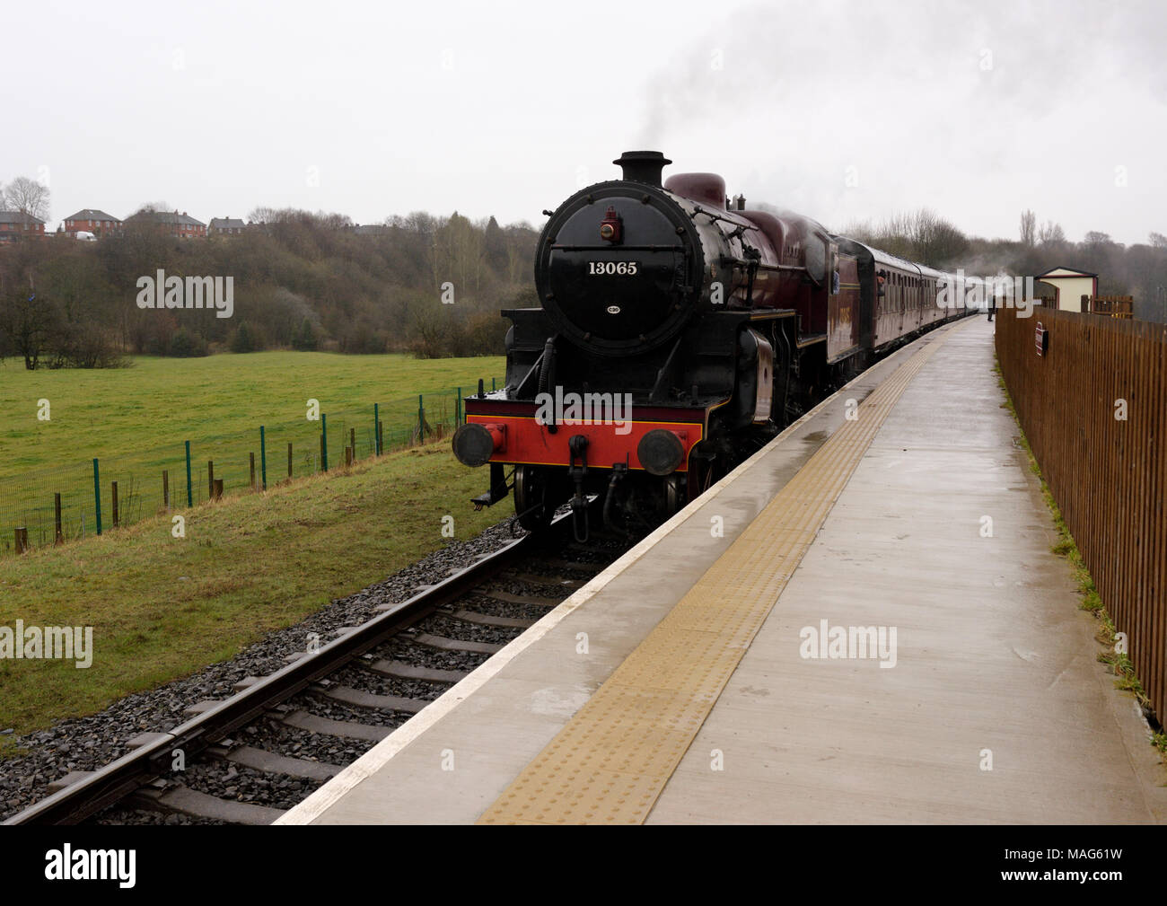 Steam train arriving at Burrs country park railway station platform on ...