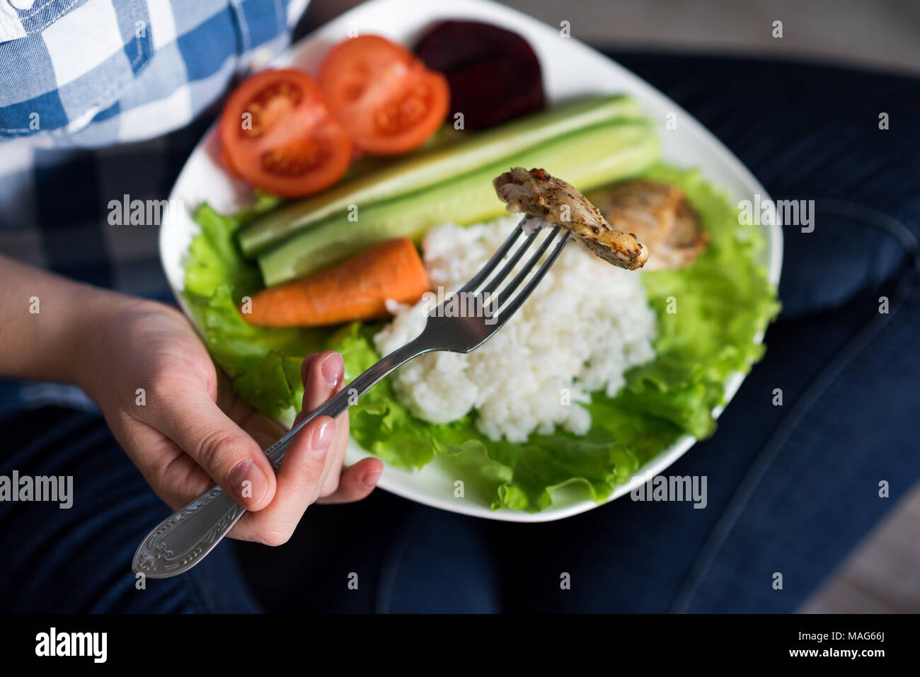 Girl with a plate of vegetables in hands Stock Photo - Alamy