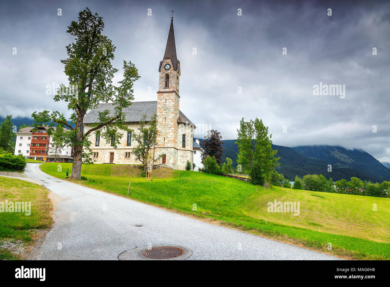 Spectacular alpine green fields and traditional Austrian village in ...