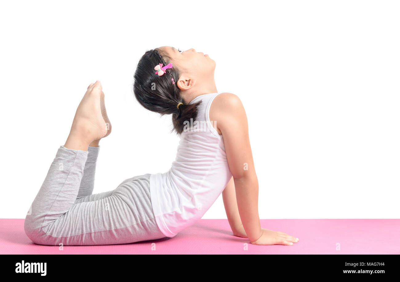 Haealthy asian kid exercise on yoga mat isolated on white background ...