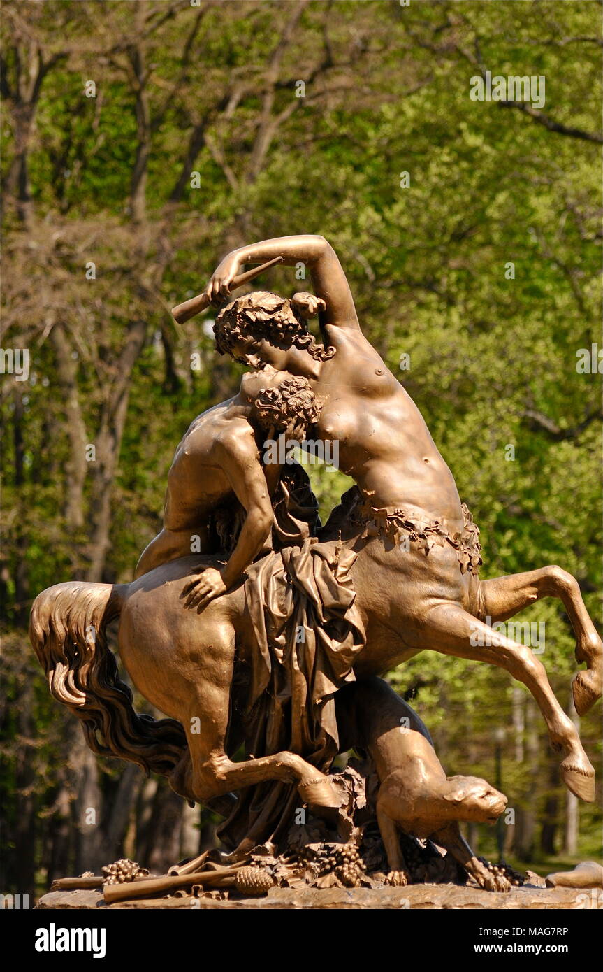 Golden statue of a Centauress seducing a young faun, Tete d'Or Park ...