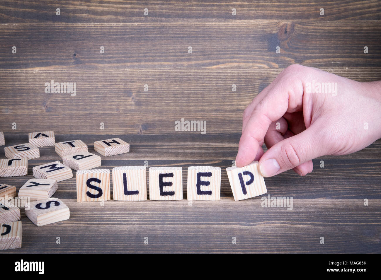 Sleep. Wooden letters on the office desk Stock Photo - Alamy