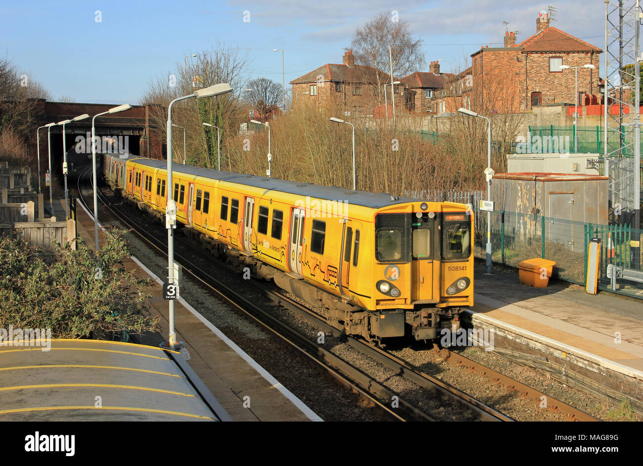 A electric suburban Mersey rail train arrives at Walton station in ...