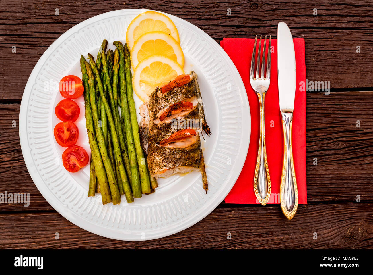 Roasted zander fillet with asparagus and lemon Stock Photo - Alamy