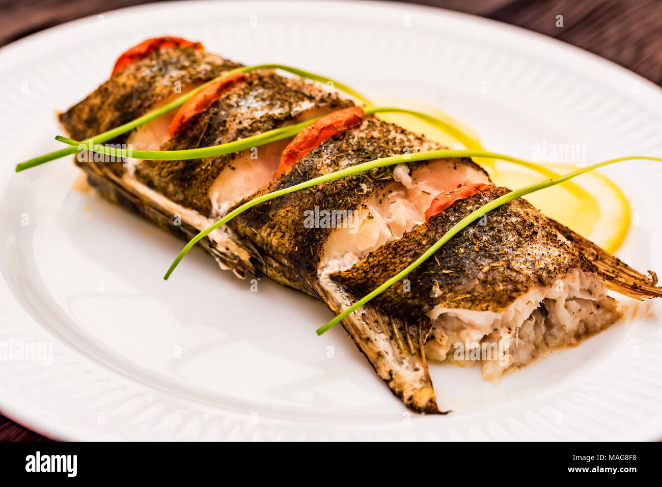 Roasted zander fillet with asparagus and lemon Stock Photo - Alamy