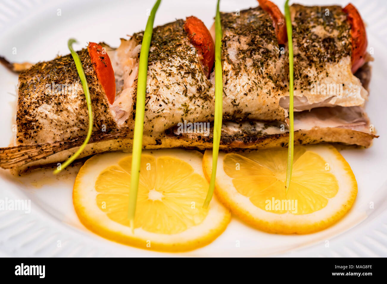 Roasted zander fillet with asparagus and lemon Stock Photo - Alamy
