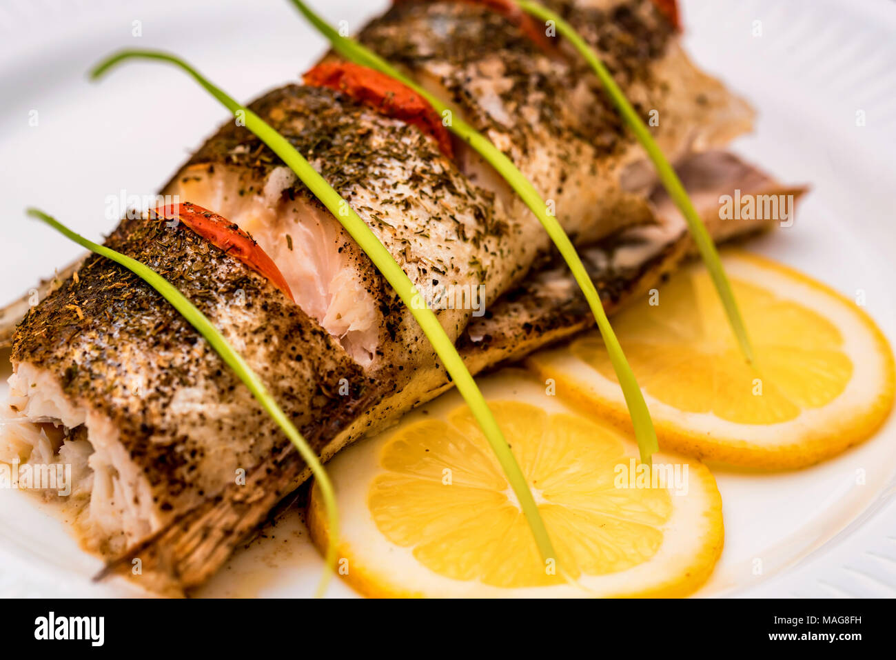 Roasted zander fillet with asparagus and lemon Stock Photo - Alamy