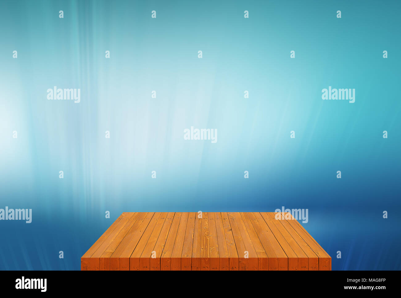 Wooden board empty table top with plain blue background Stock Photo - Alamy