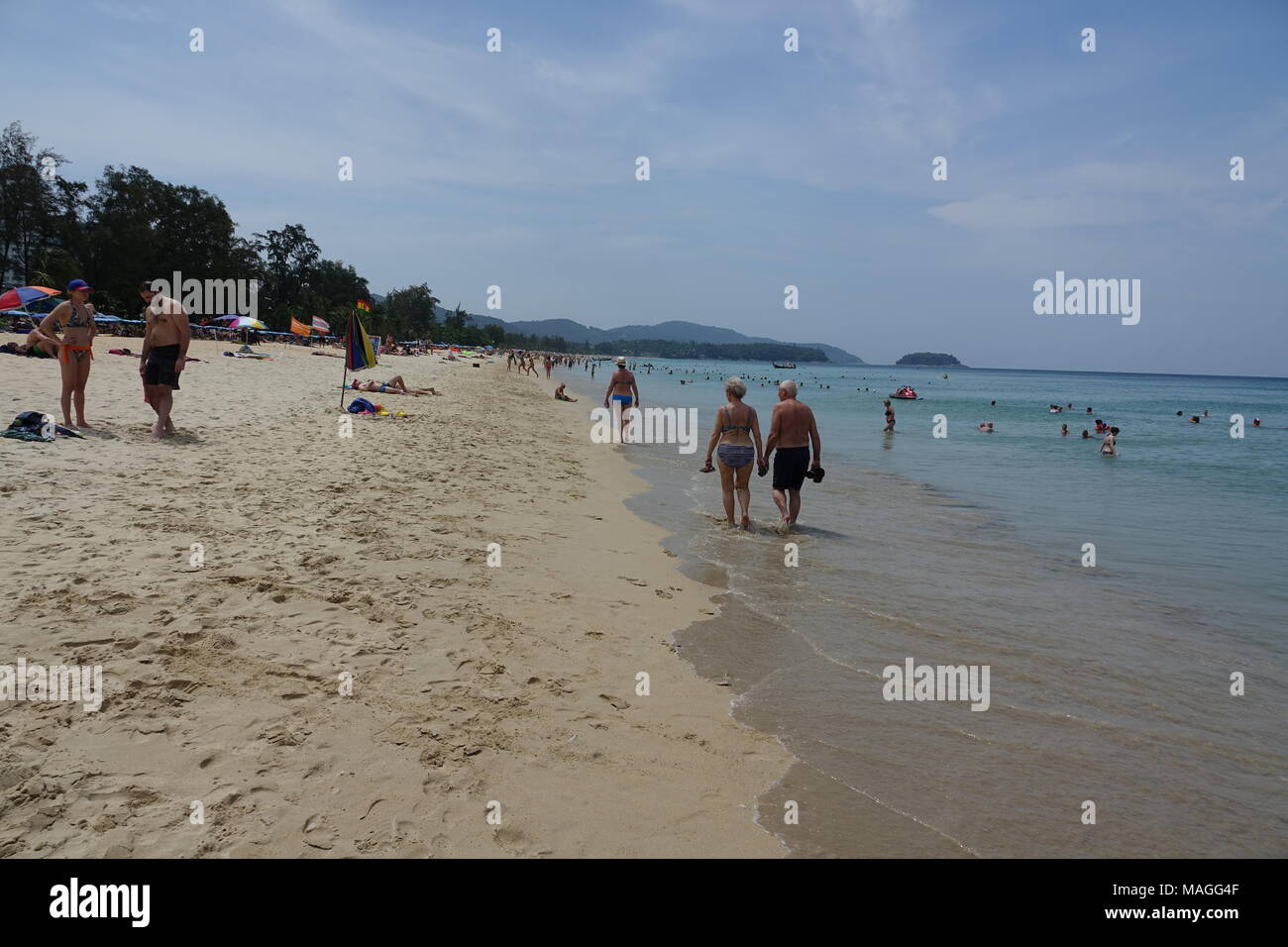 14 March 2018, Thailand, Karon Beach: Tourists walking and sunbathing ...
