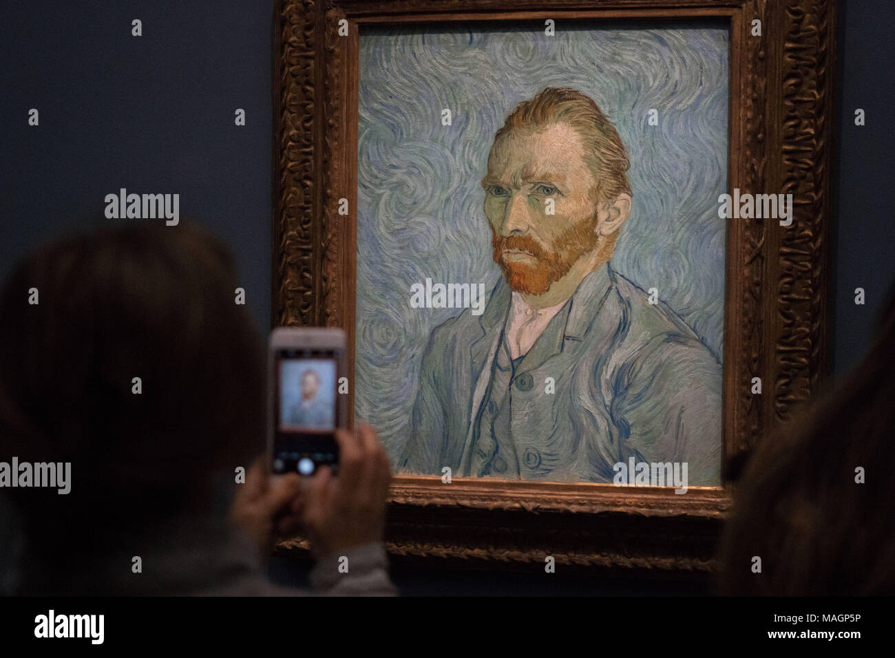 Paris, France. 21st Feb, 2018. A person takes a cell phone photo of a ...