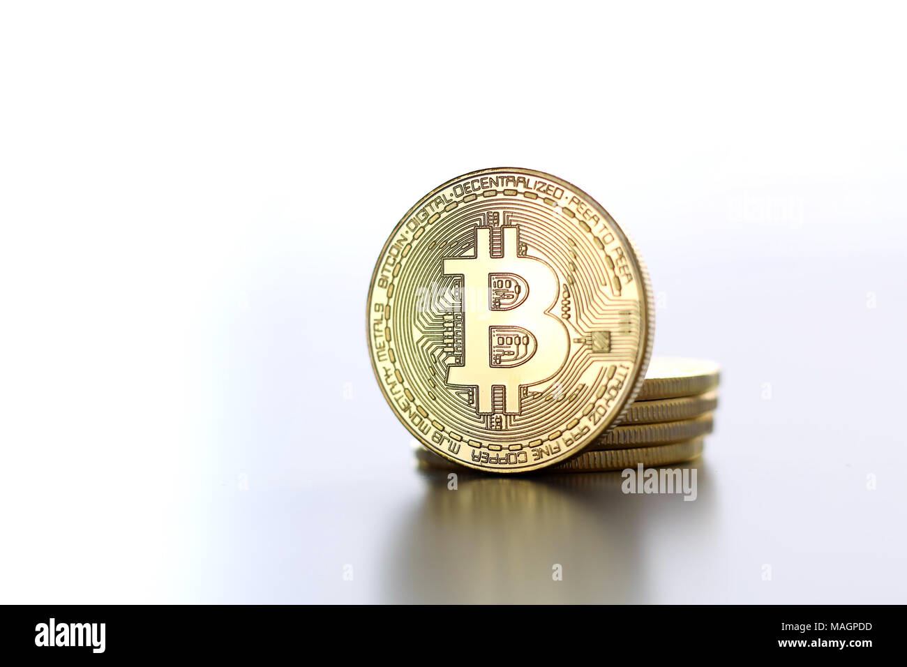 Golden Bitcoin facing the camera in sharp focus, close-up. Virtual ...