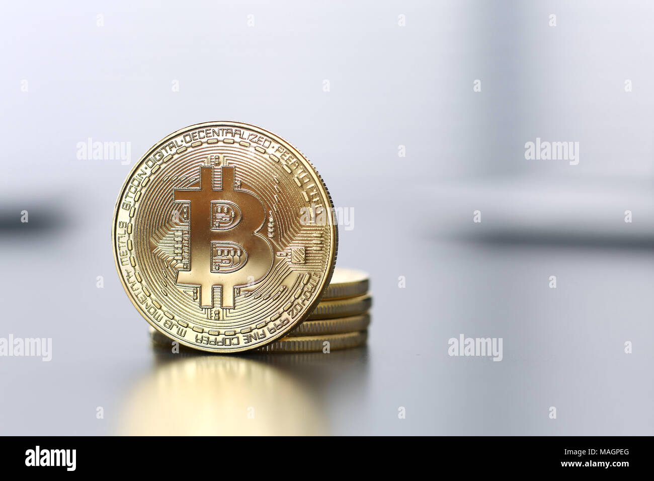 Golden Bitcoin facing the camera in sharp focus, close-up. Virtual ...
