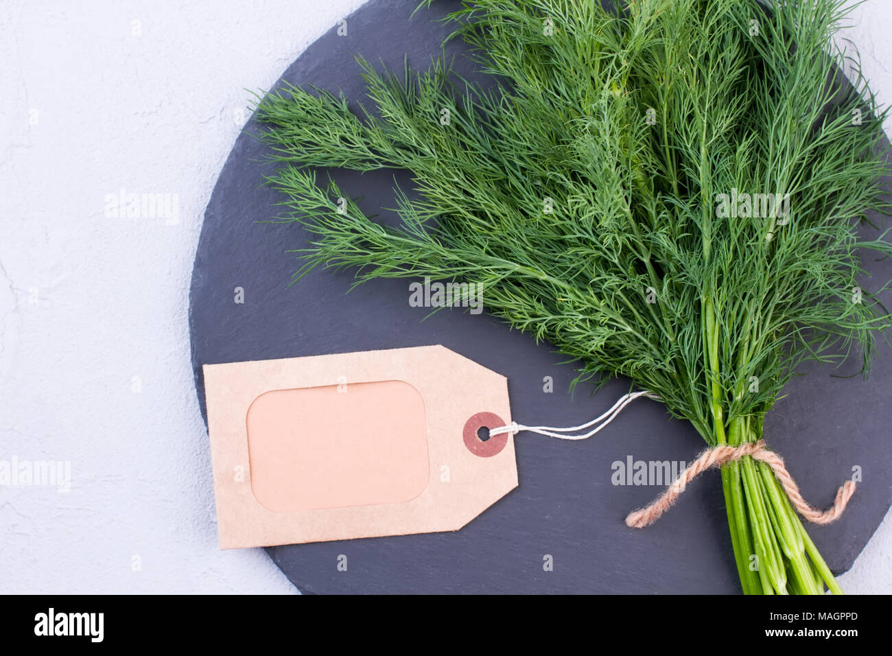 Bunch of fresh dill with label. Fresh dill with blank price tag on ...