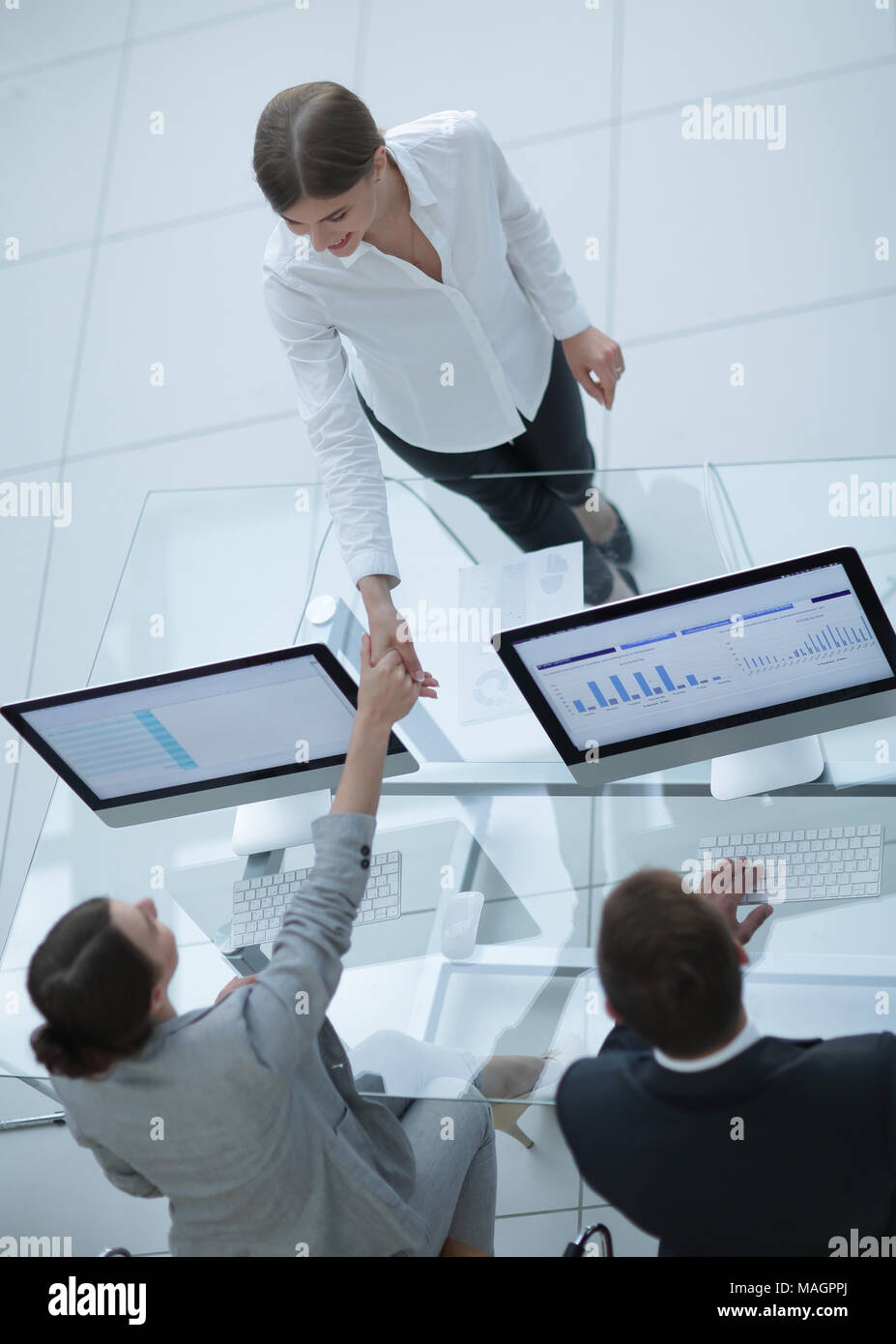 Handshake Through Monitor High Resolution Stock Photography and Images ...